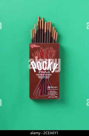 Pocky brand of chocolate sticks on white background. Pocky is a famous ...