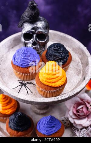 Sweets for halloween party. Funny homemade Halloween cupcakes on modern ...