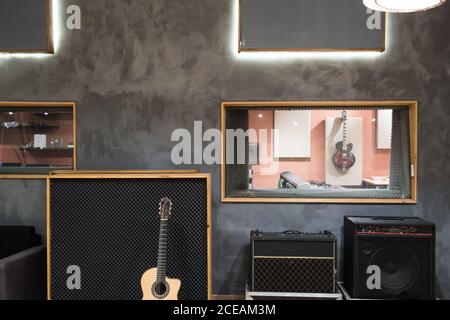 Acoustic guitar near amplifier Stock Photo - Alamy