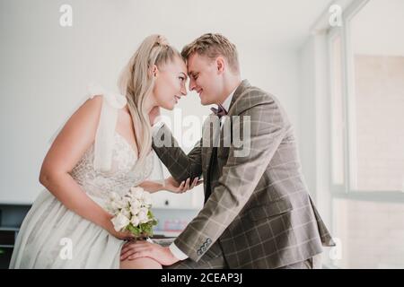 Happy couple cuddling each other Stock Photo - Alamy