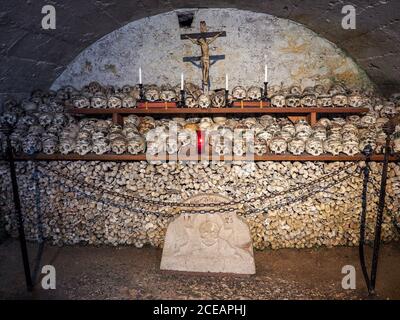 painted skulls and bones in the Hallstatt ossuary, Hallstatt ...