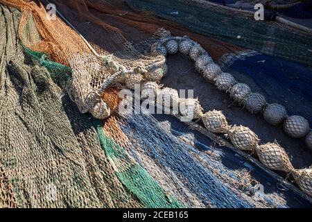 View of fishing nets on the ground. Big green fishing net. Close-up ...