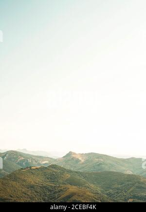 Sunbeams in clouds over valley landscape photo Stock Photo - Alamy