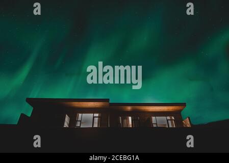 A beautiful shot of bright green Northern Lights over a lake Stock ...