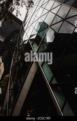Facade of modern high-rise building with glass windows. Texture of ...