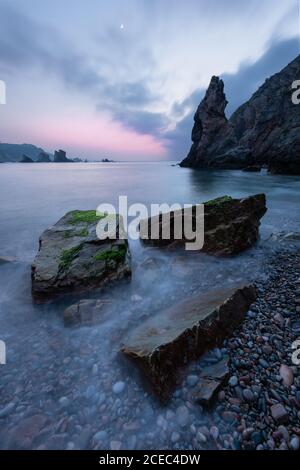 A beautiful view of a calm sea during sunset Stock Photo - Alamy