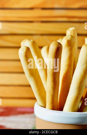 Closeup shot of fresh breadsticks in a paper package isolated on a ...