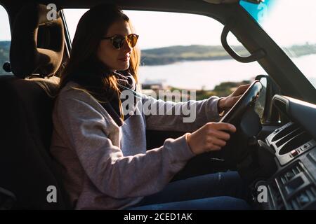 Woman driving modern car, view through windshield Stock Photo - Alamy