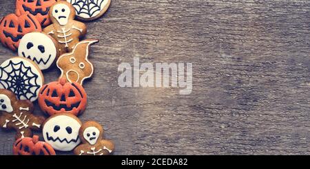 Halloween gingerbread cookies on wooden background Stock Photo - Alamy