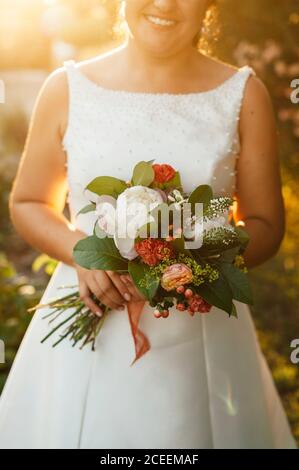 Male chef placing steak slices in bowl on counter in restaurant kitchen ...