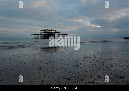 The silhouetted outline of Brighton's ruined burnt out West Pier ...