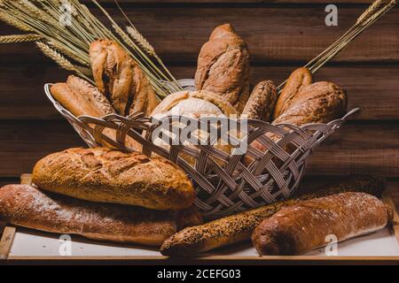Assortment Of Fresh Artisan Bread Loaves On Floured Wooden Rustic Table ...