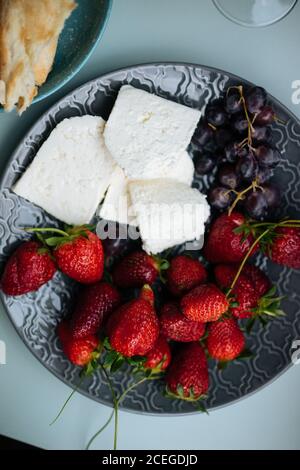 Tasty beautiful cheese composition on wooden board Stock Photo - Alamy