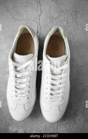 White plimsolls made of tumbled leather, matching laces, fabric lining ...