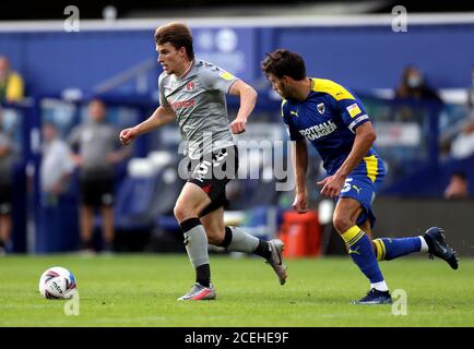 AFC Wimbledon's Joshua Davison (left) and Weymouth's Daniel Matsuzaka ...