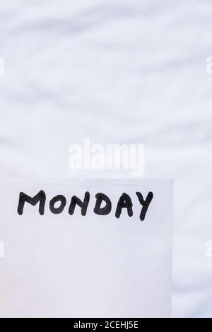 Monday handwriting text close up isolated on white paper with copy ...