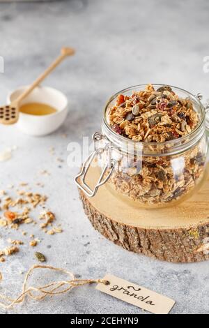 Tasty oatmeal with berries and dried fruits in bowl on table Stock ...