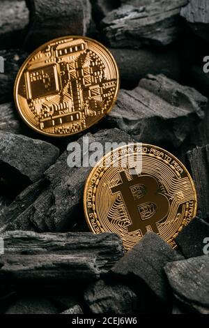 Bitcoins on coal background Stock Photo - Alamy