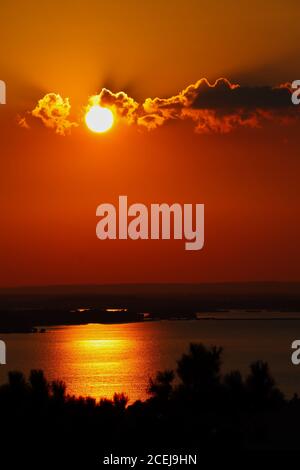 A tranquil scenery of a magical sunset over the meadows Stock Photo - Alamy