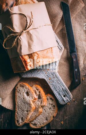 Homemade loaf of bread on dark and rustic table Stock Photo - Alamy