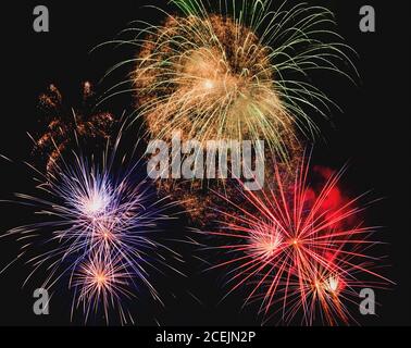 From below shot of wonderful vivid fireworks exploding on background of ...