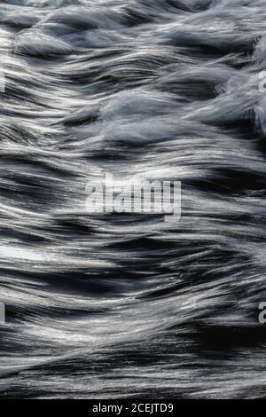 Rushing clear river water splashes over rocks Stock Photo - Alamy