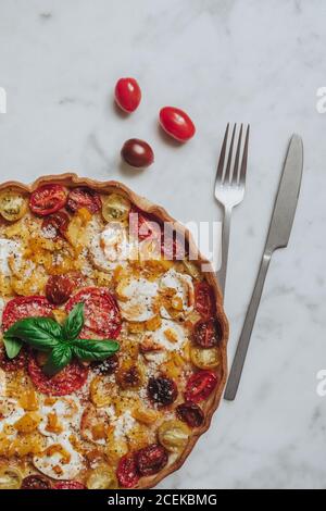 Baked pizza with tomatoes from above Stock Photo - Alamy