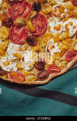 Baked pizza with tomatoes from above Stock Photo - Alamy