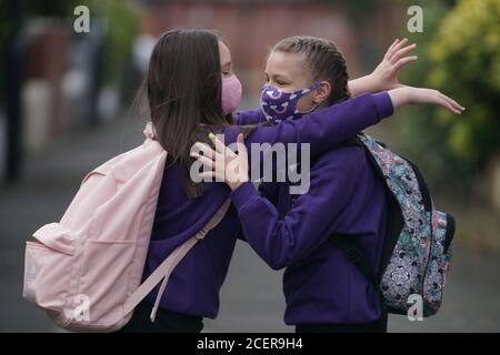 RETRANSMITTING AMENDING BYLINE Kadie Lane (right), 11, and Brooke ...