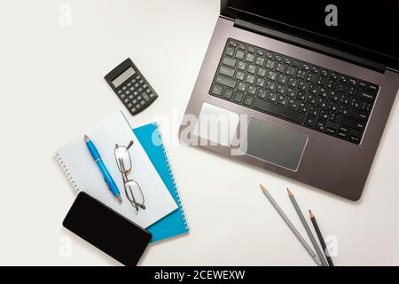 Banner with laptop, glasses, notepad and stationery on a pink pastel ...