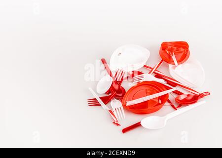 red plastic trash scattered on white background, panoramic shot Stock ...