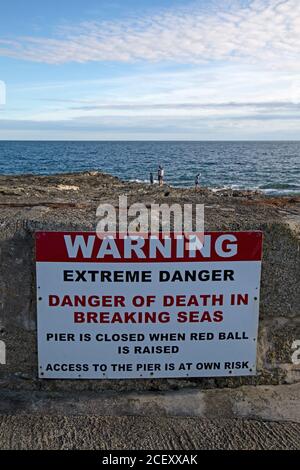 Sign on beach warning people of possible contaminated ocean water. Sign ...