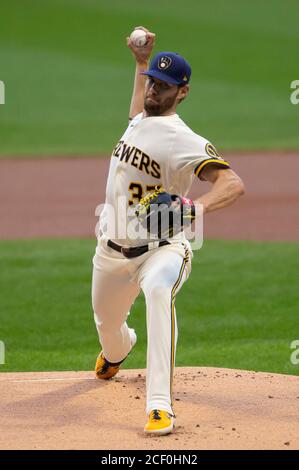 Milwaukee Brewers starting pitcher Adrian Houser heads to the dugout ...
