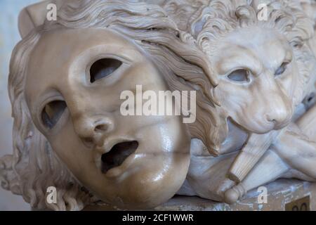 Ancient theatre mask, made of marble, located at the base of a Roman ...