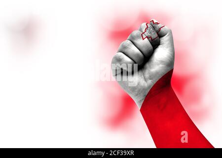Flag of malta painted on male fist, strength,power,concept of conflict ...