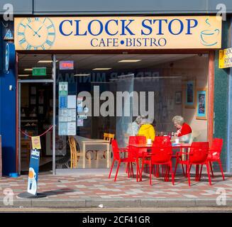 Customers enjoying refreshment at Clock Stop café Bistro by the town ...