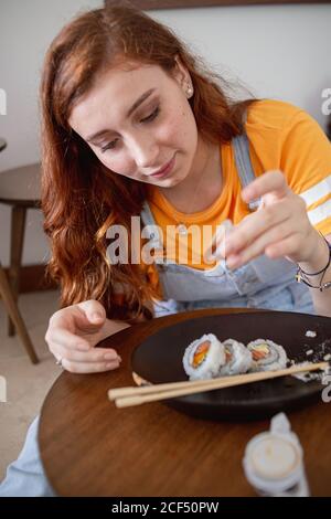 An oriental woman using chopsticks Stock Photo - Alamy