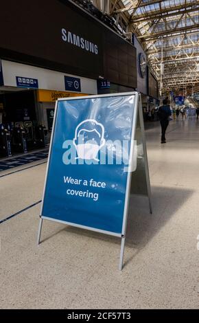 Commuters wear face masks inside a bus in Madrid, Spain, March 22, 2020 ...