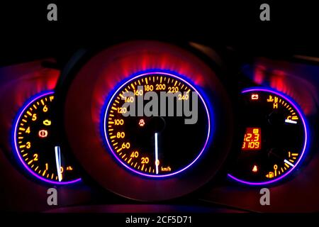 Car instrument panel with neon illumination on digital display with ...