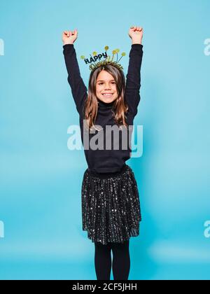 preteen girl in trendy outfit and hat adjusting sunglasses isolated on pink Stock Photo - Alamy