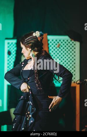 Middle age hispanic artist woman smiling happy holding canvas at art ...