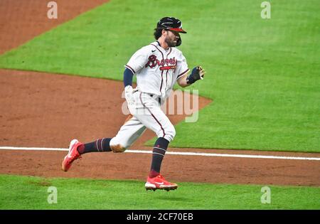 ATLANTA, GA – AUGUST 22: Atlanta shortstop Orlando Arcia (11) breaks ...