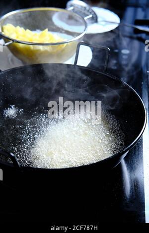 Blur of hot and boiling food oil in pan while fried chicken Stock Photo ...
