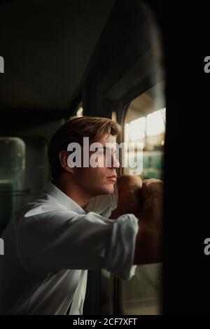 Railroad travel leaning out the window Stock Photo - Alamy