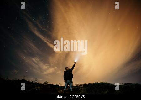 Man Standing Under The Starry Night Sky, Lighting With Head Lamp Stock ...