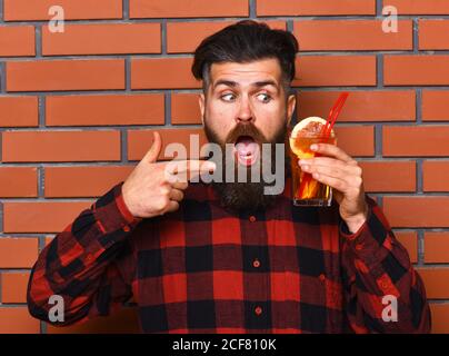 surprised stylish bearded guy with trendy hairstyle wear checkered ...