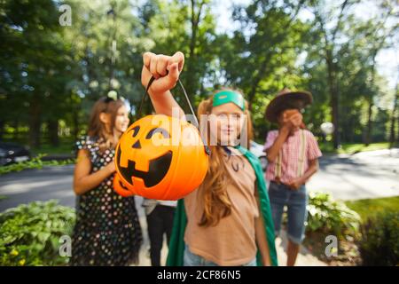 Halloween celebration. Man holding pumpkin with carved spooky face on ...