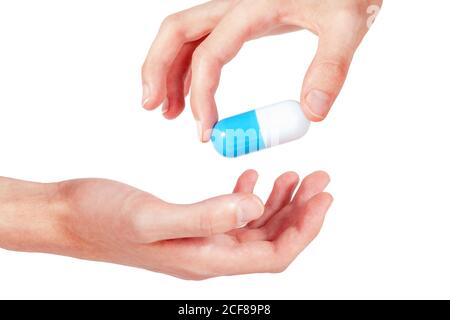 Doctor giving a pill concept Stock Photo - Alamy