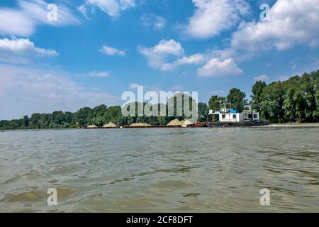 Novi Becej, Tisa River, Serbia May 14, 2017. A group of men throws a ...