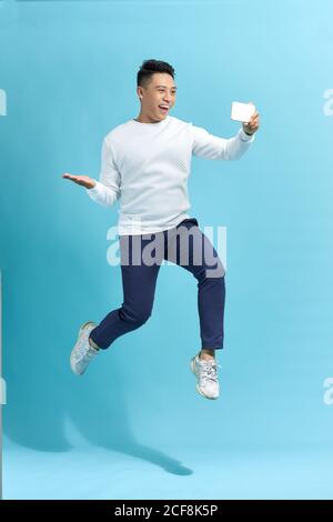 Full length photo of happy positive young charming woman jump up make v ...